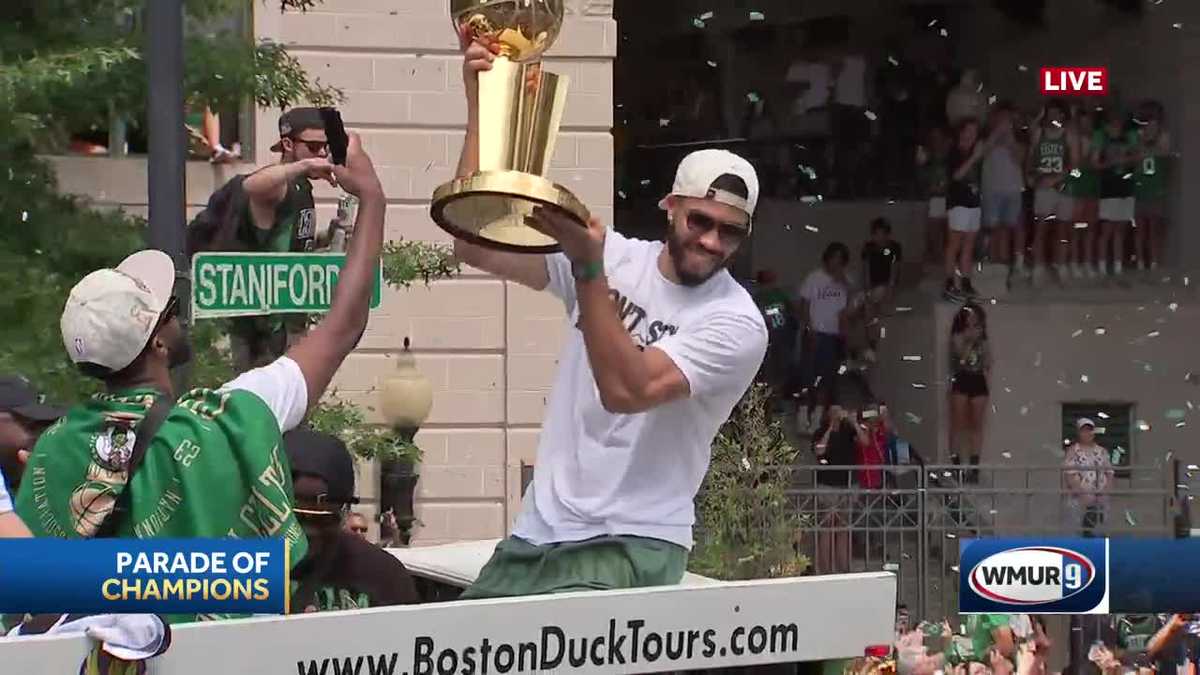 Jayson Tatum hoists NBA championship trophy during Celtics parade