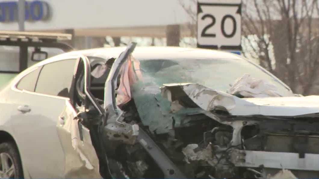 Car hits sign, porch in Racine