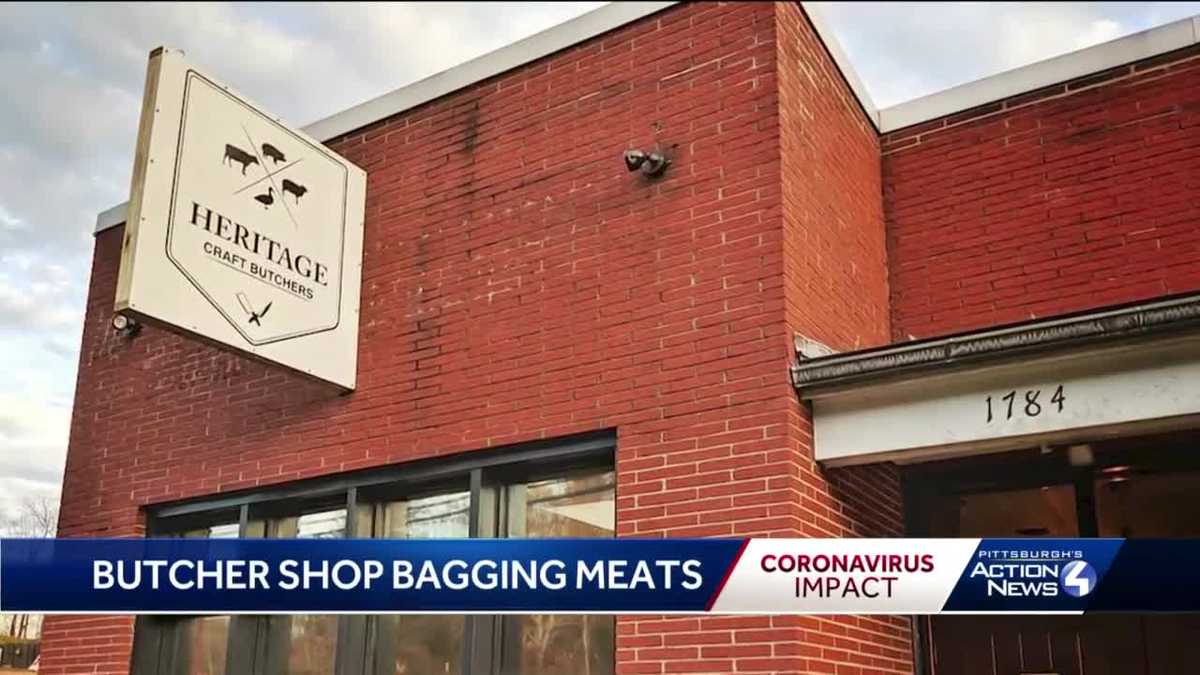 Local butcher bagging meats; selling them out of refrigerated truck