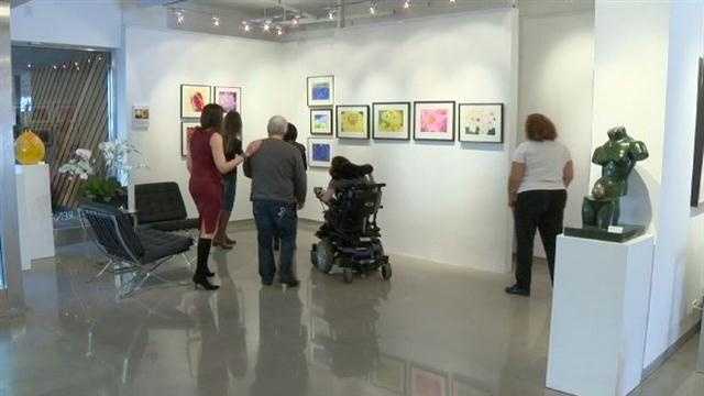 Artist overcomes cerebral palsy, gets exhibit