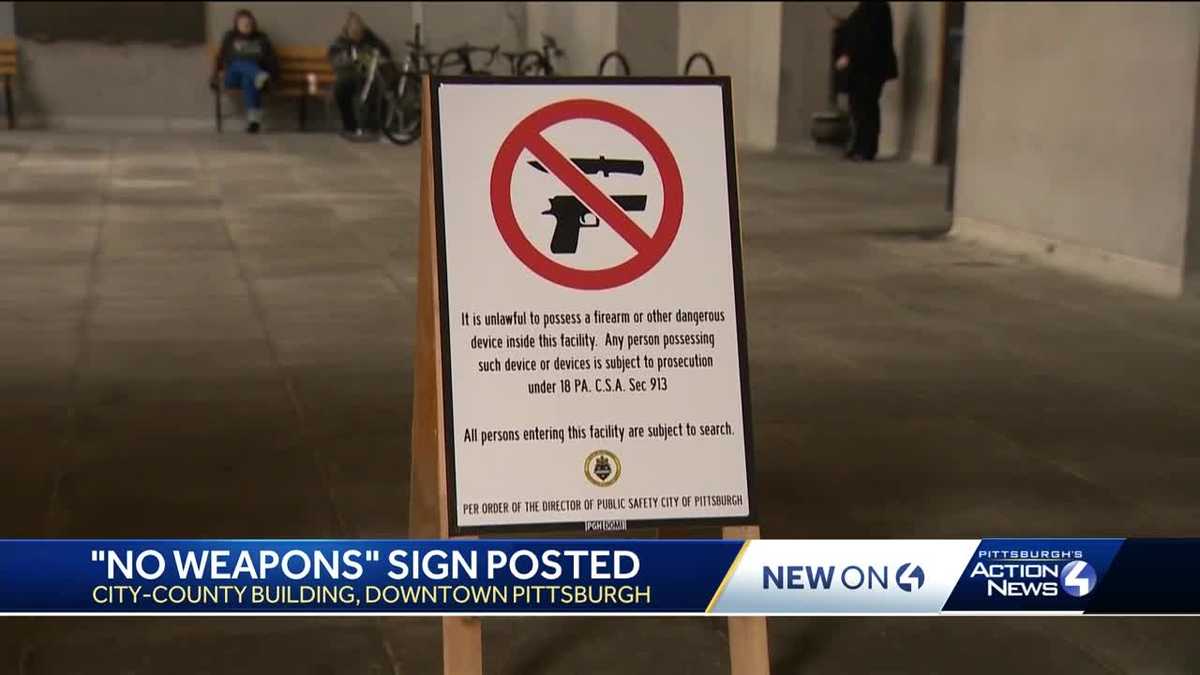 City County Building armed with signs to stop guns from entering