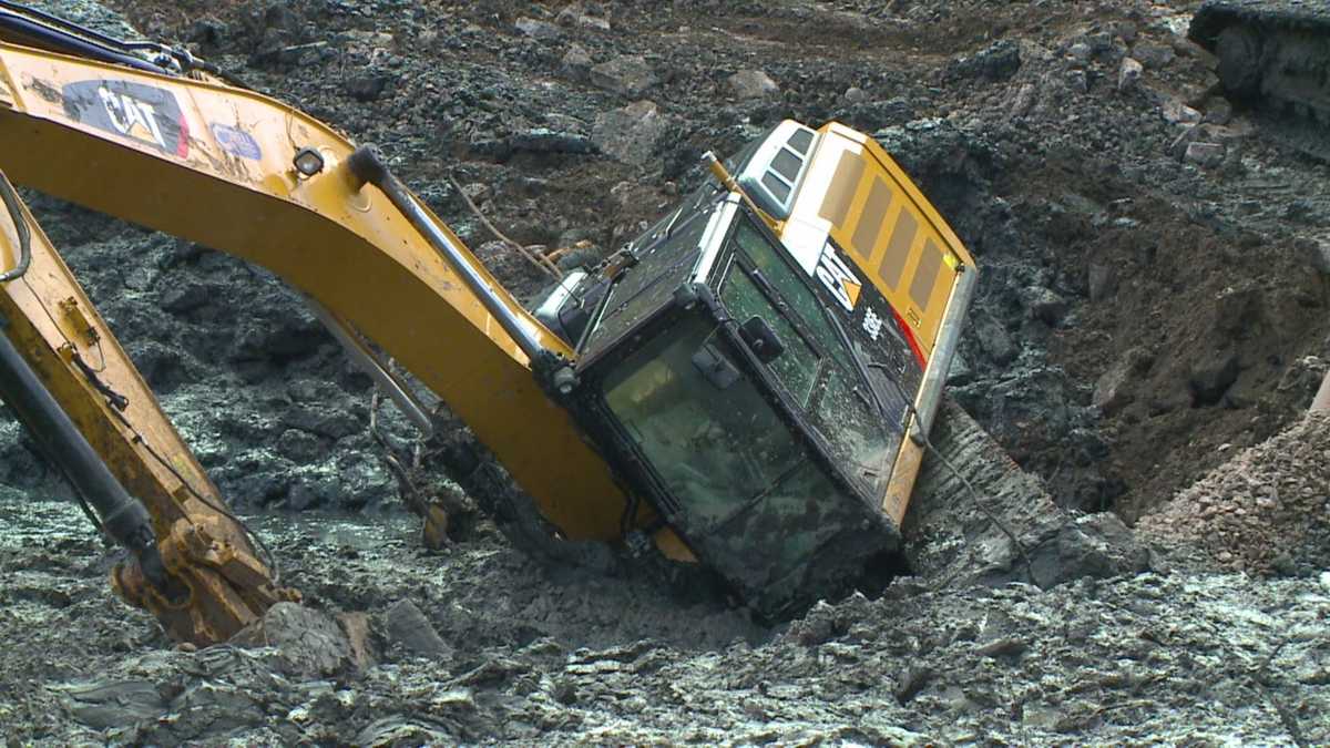 Excavator still stuck in pond