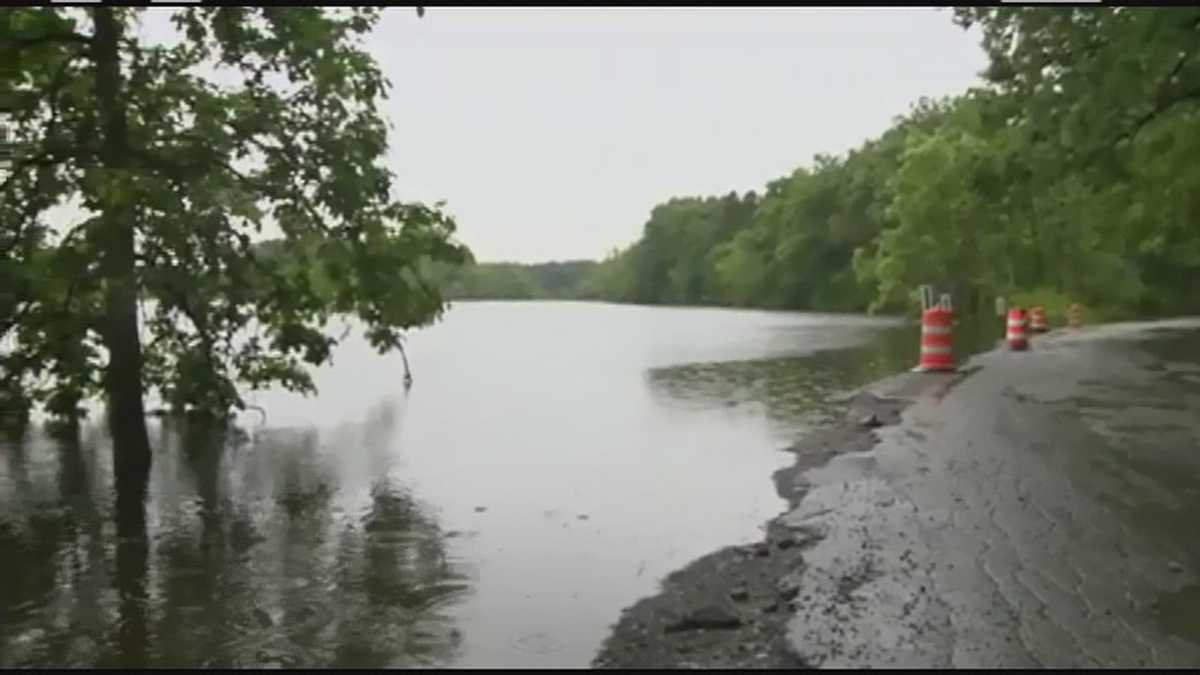 Rivers overflow banks, flood yards and roads