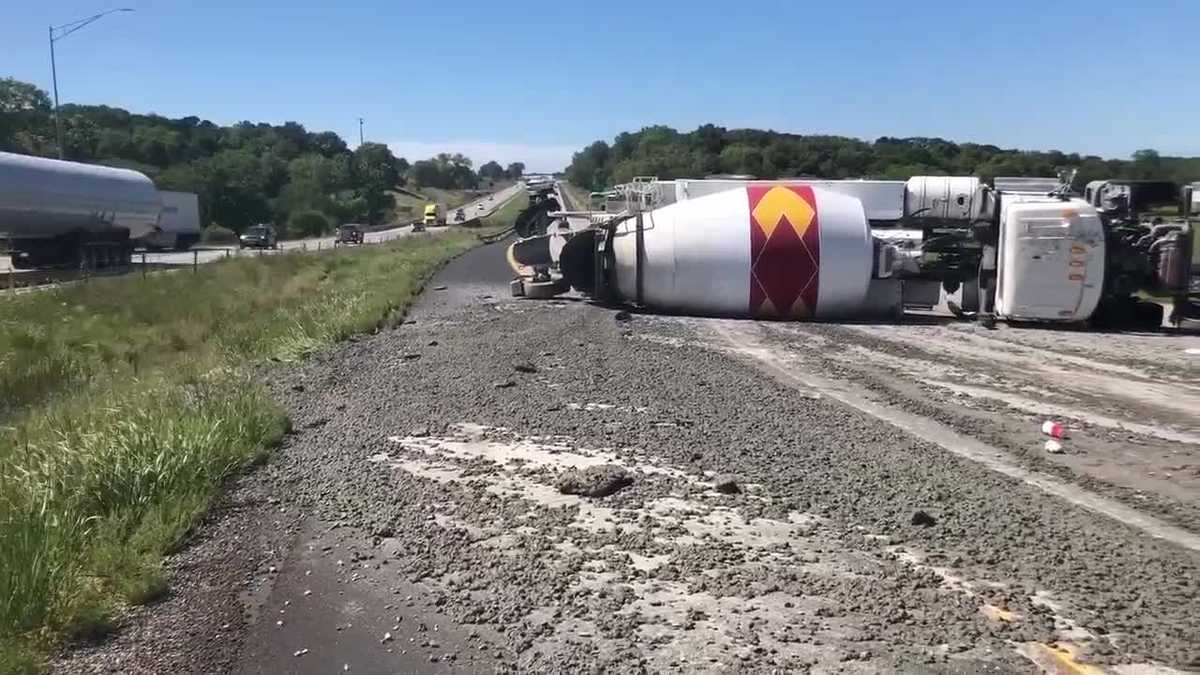 Cement truck rolls and spills on I-80