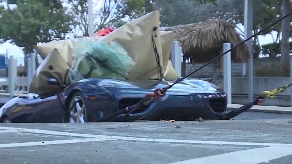 Dash cam video shows driver of Ferrari plunging into water