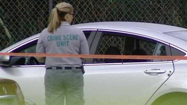 Maintenance worker discovers 2 bodies in bullet-riddled car