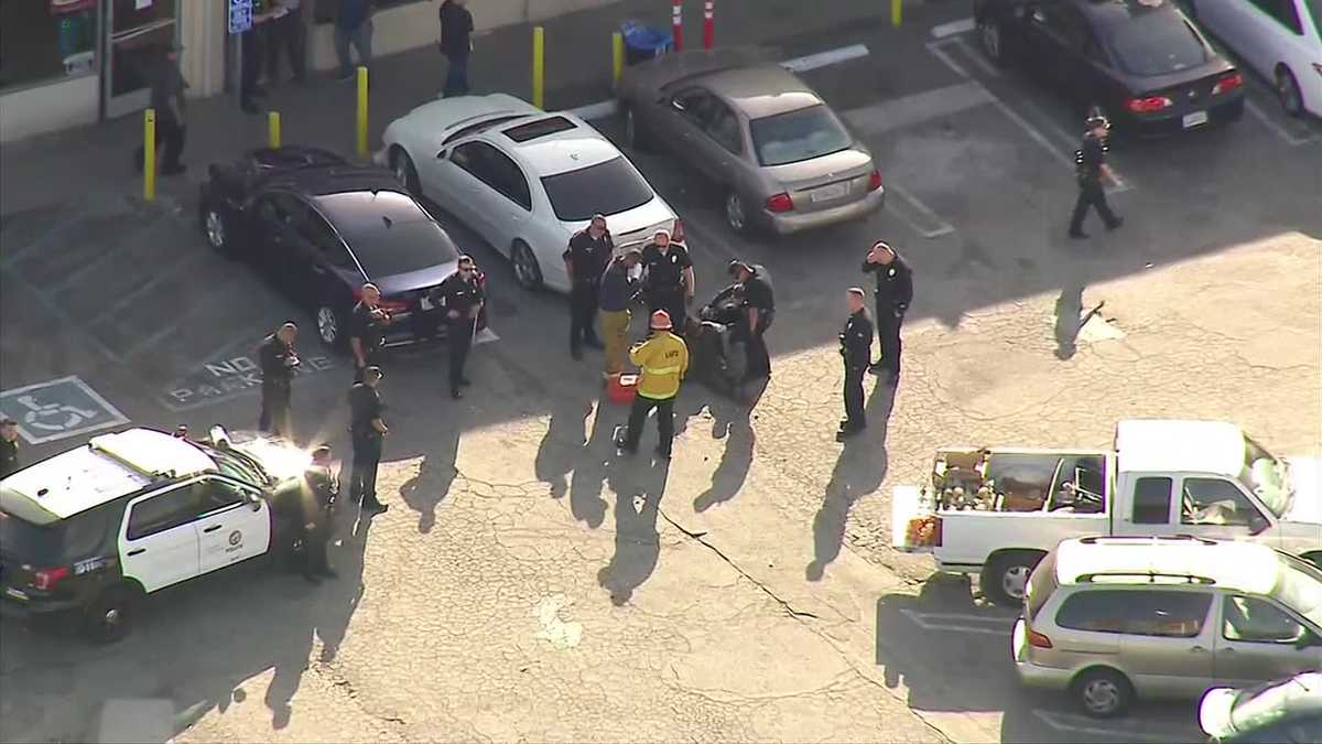 Police use Taser on man carrying machete through parking lot