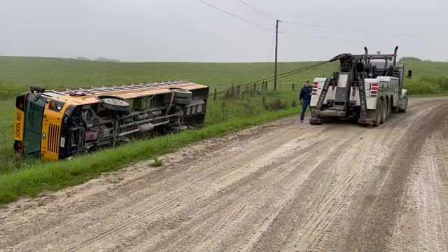 School bus carrying 10 students rolls into Madison County ditch
