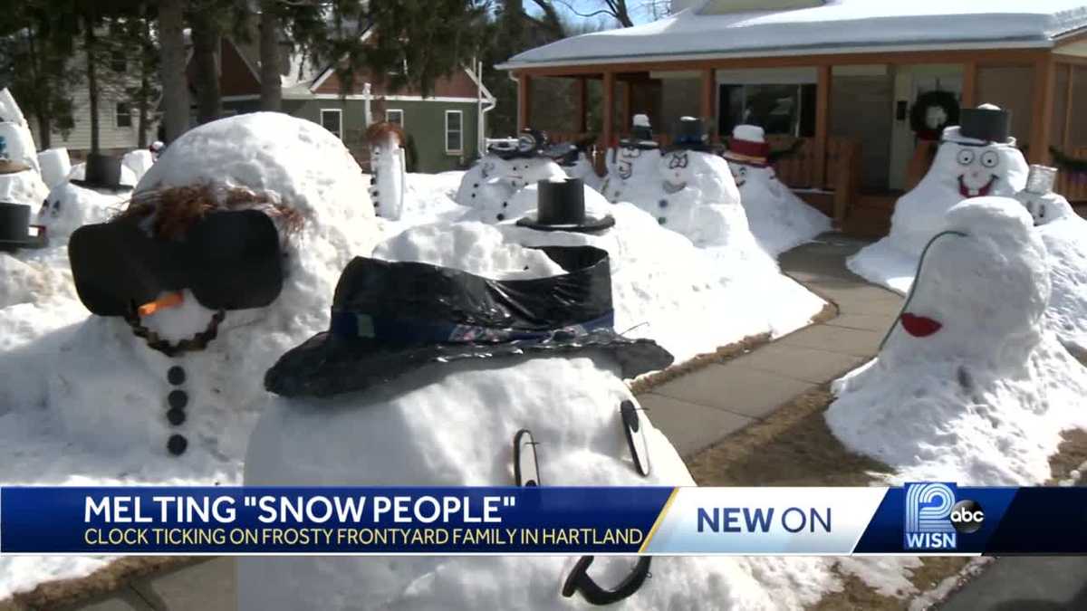 Frosty family of 'snow people' starting to melt