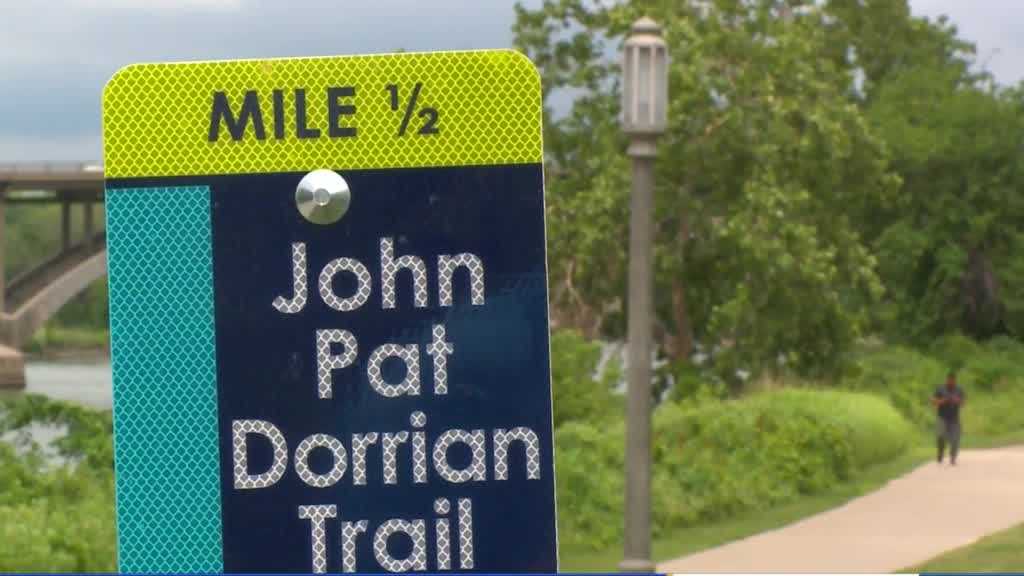 Emergency checkpoint signs line Des Moines bike trails to keep people safe