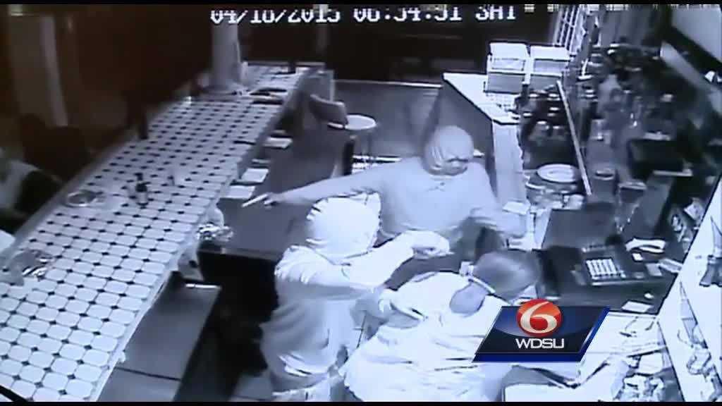 Raw Video: Surveillance video shows armed men rob bar, patrons