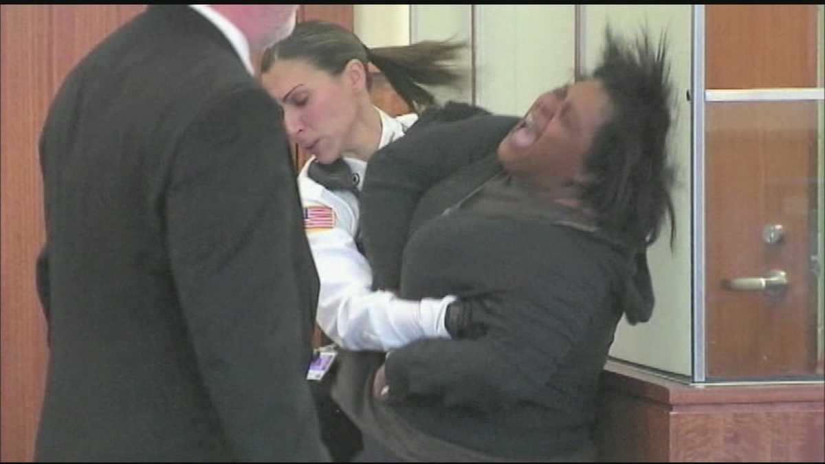 Mass. officers restrain woman after court outburst