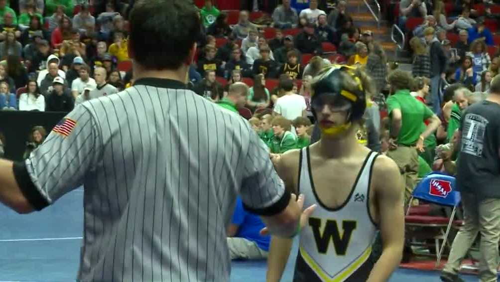 Iowa wrestler putting up a fight on and off the mat