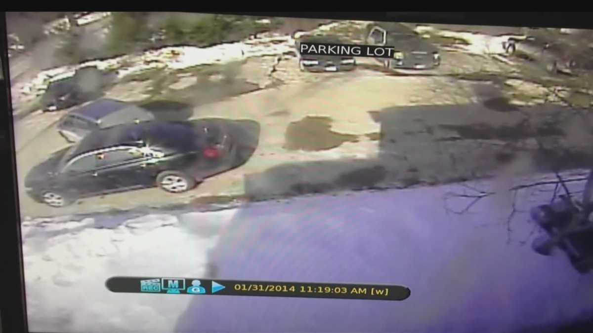 Surveillance video: Police cruiser hit in parking lot