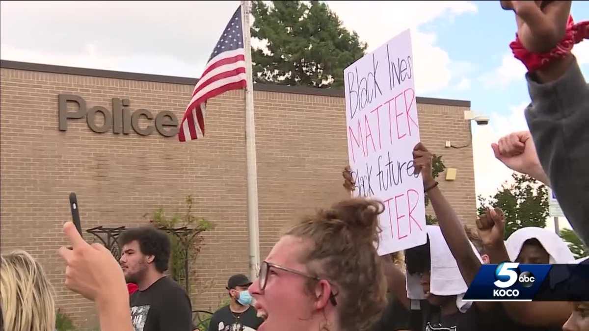 Demonstrators protest outside Norman Police Department