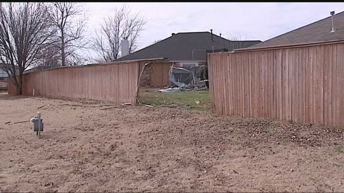 Car crashes through fences, hits Norman home