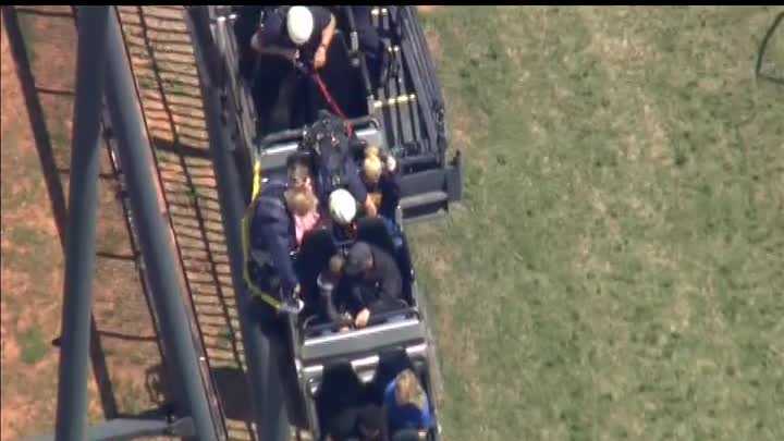Sky 5 flies over stuck roller coaster at Frontier City