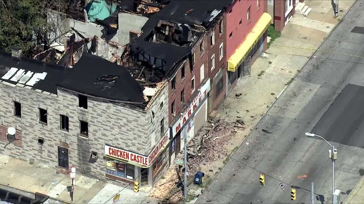 Part of building collapses, sending debris into road in east Baltimore