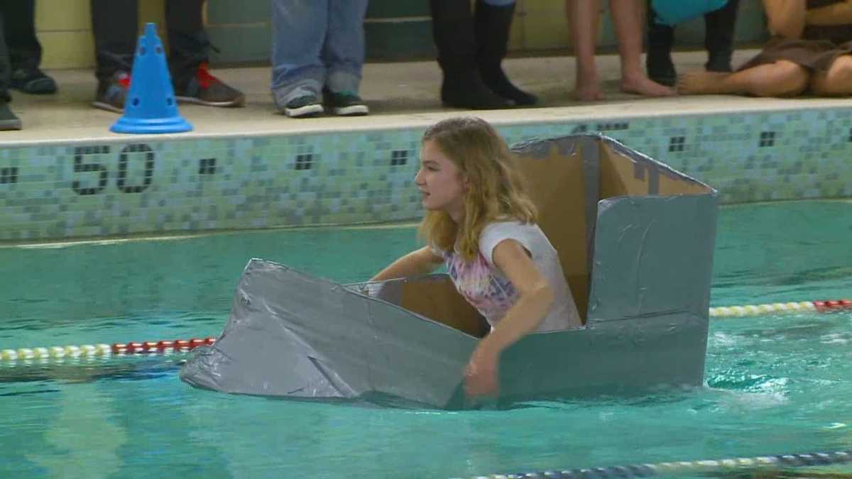 Cardboard boats race across school pool