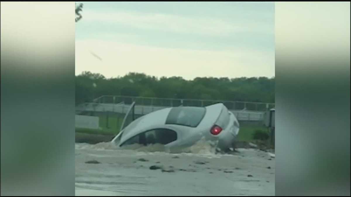 Car stuck in sinkhole after crash into hydrant
