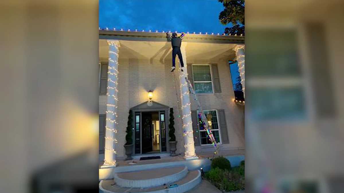 Passerby panics, calls 911 after seeing 'Clark Griswold' hanging off roof