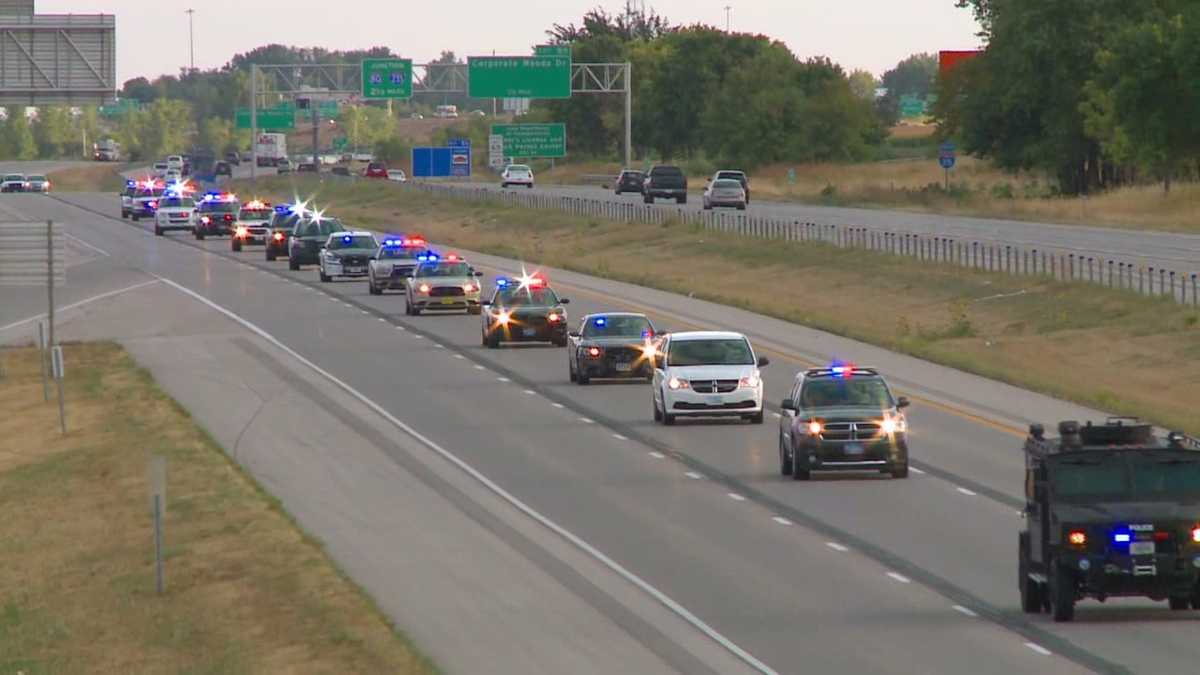 Motorcade escorts fallen officer back home