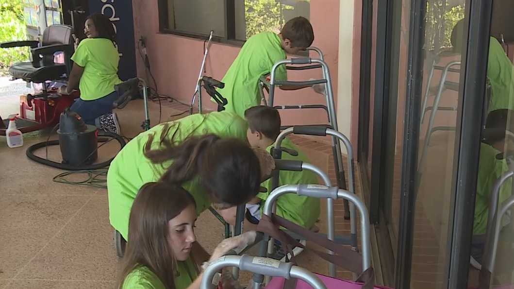 Kids clean and decorate walkers, wheelchairs at senior facility