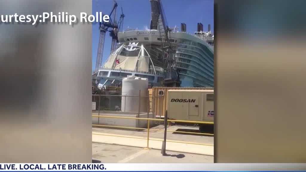 Local cruise ships help crew members on ship damaged by crane