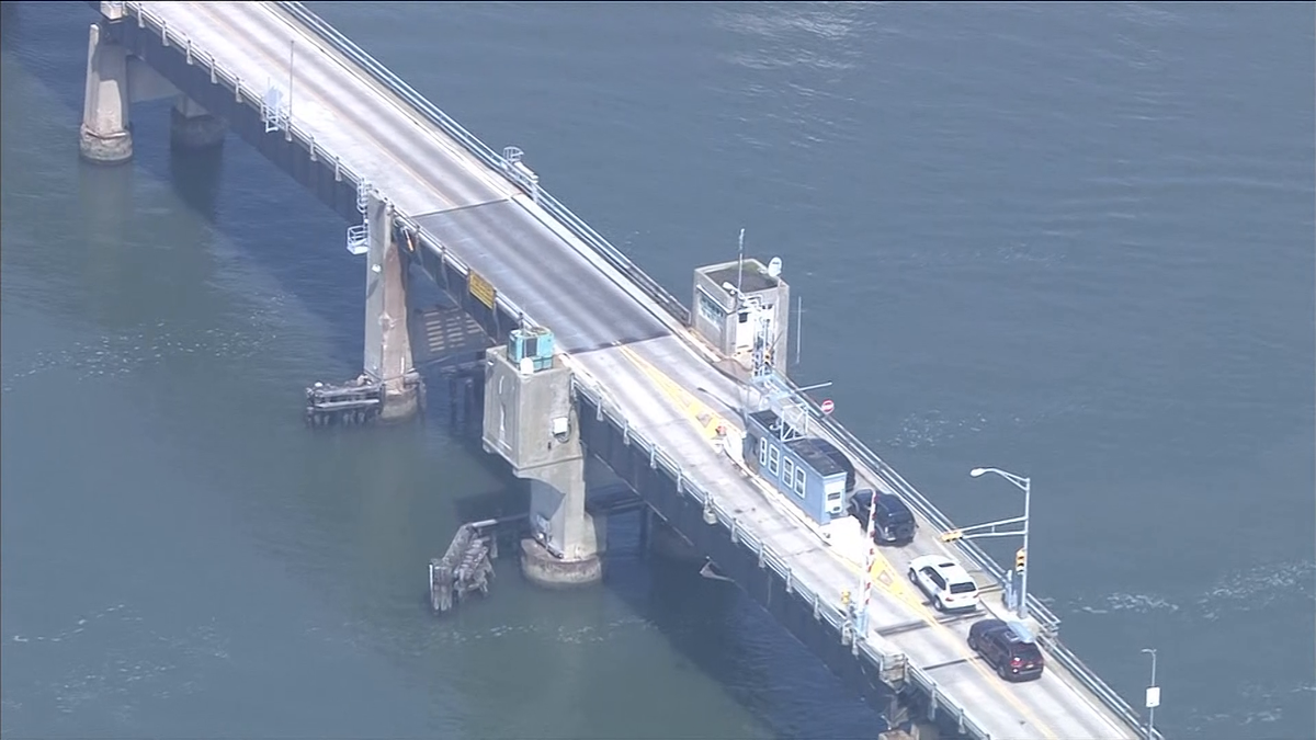 Terrified family forced to jump gap after getting stuck on rising ...