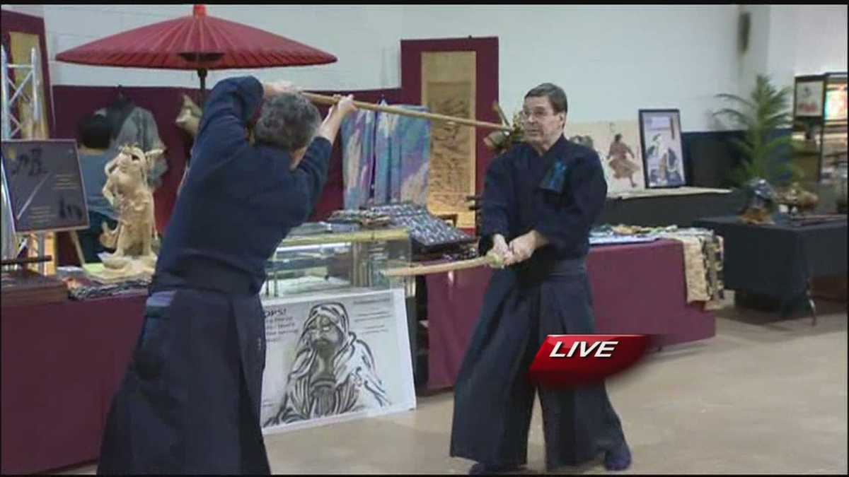 Ava checks out sword-fighting demo ahead of show