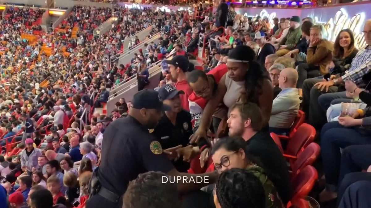 Man resisting arrest falls down rows of seats at NBA game