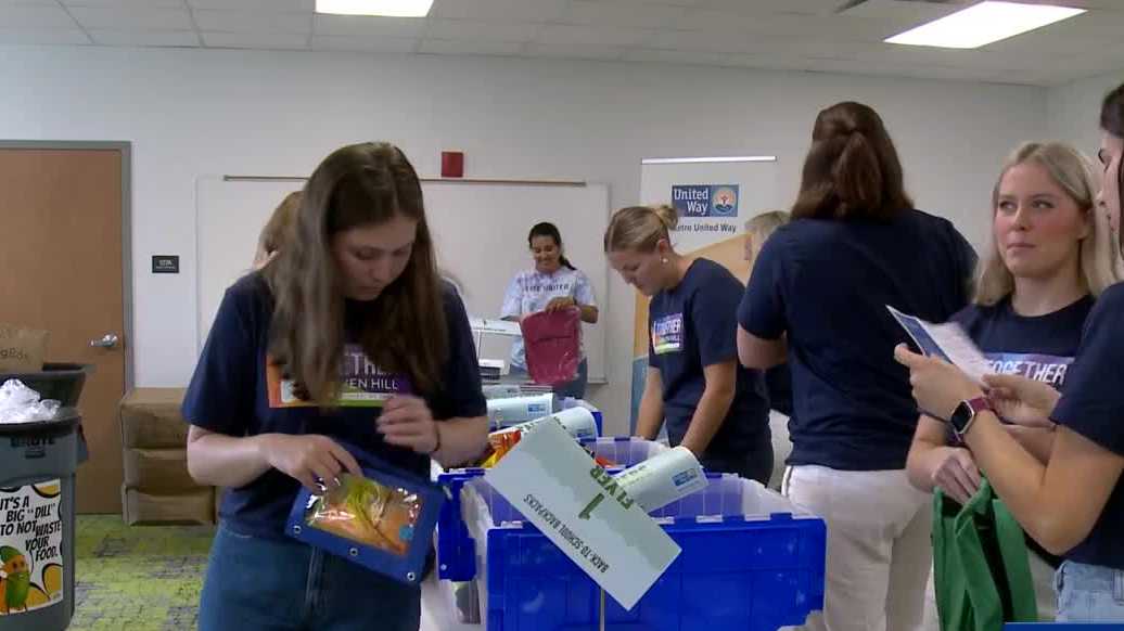 Louisville interns pack backpacks with supplies for JCPS students