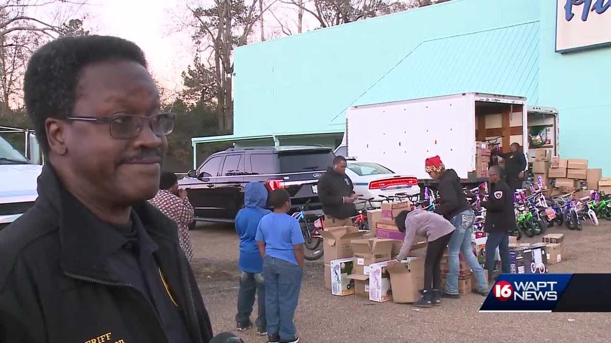 Sheriff Victor Mason and his team of Elves gave toys to children in Jackson