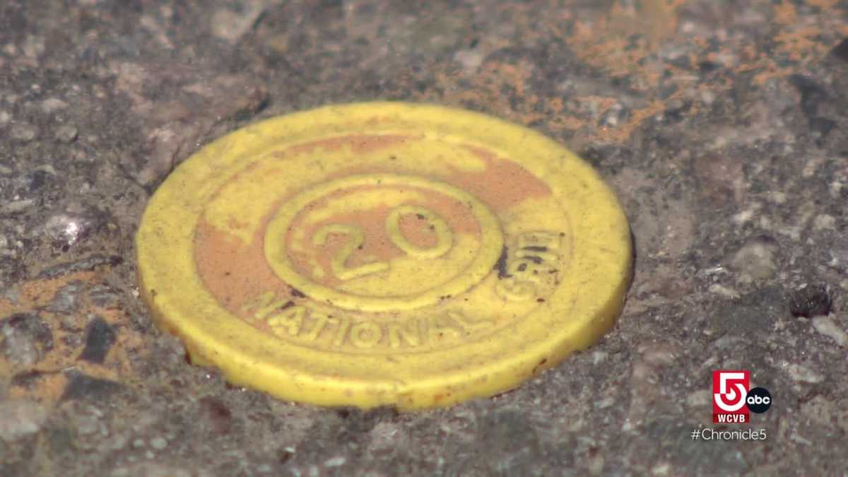 Ever see colorful tokens stuck in the asphalt on Boston streets? There ...