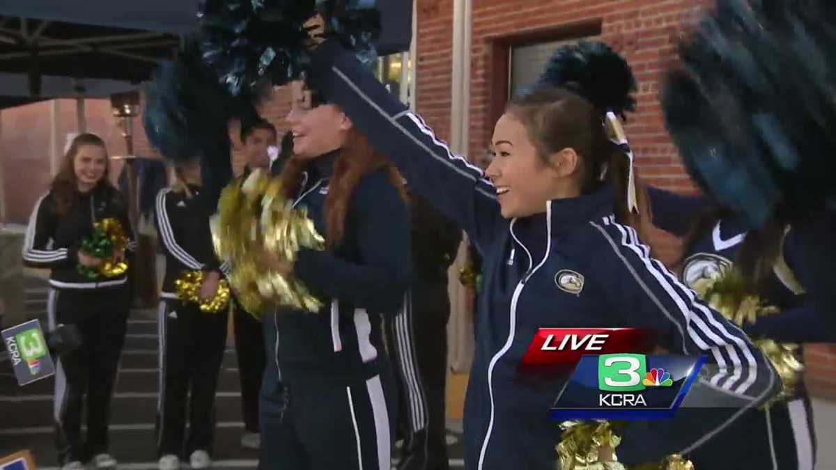 Sac State & Davis cheerleaders help pump up crowd at Turkey drive