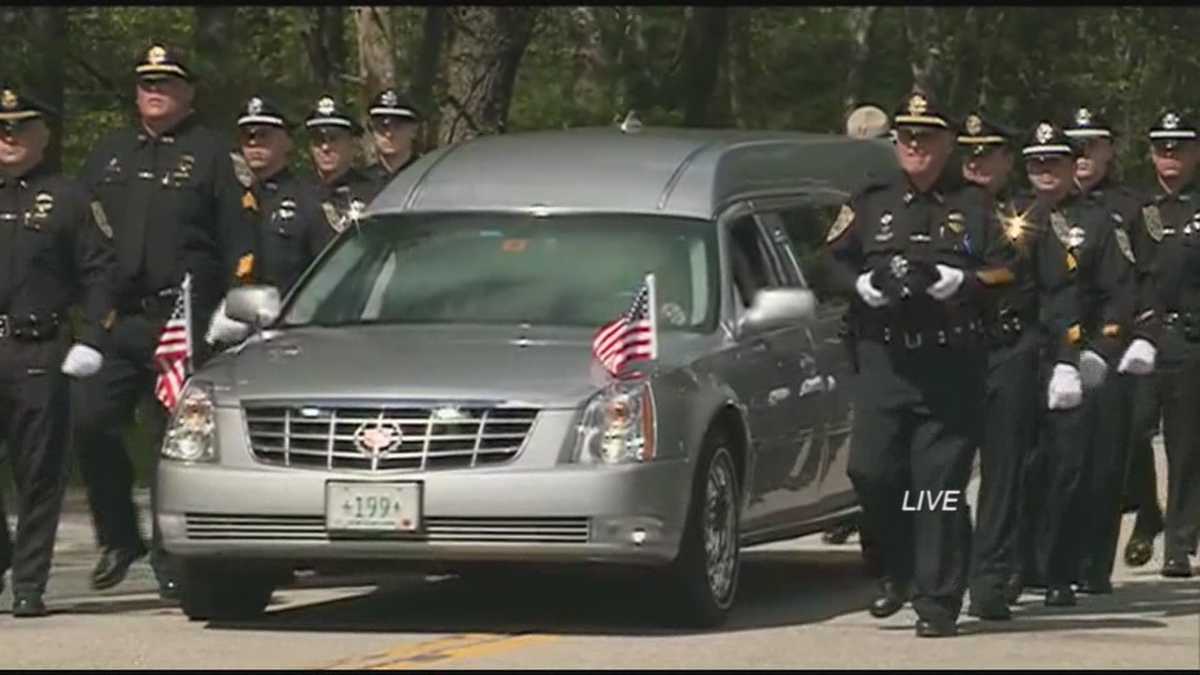 Hearse drives by during procession for Stephen Arkell