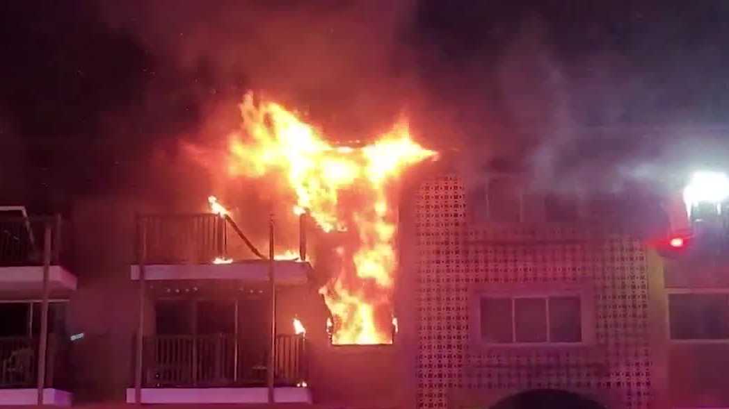 Men rush to help catch children thrown during Manchester fire