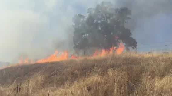 Fire burns along Highway 49 in Coloma