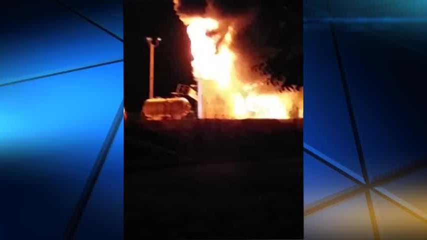 Lightning strikes oil tank, ignites fire