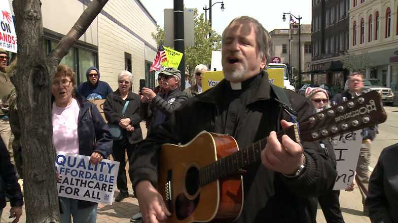 Protesters gather outside House Speaker Ryan's Racine office during ...