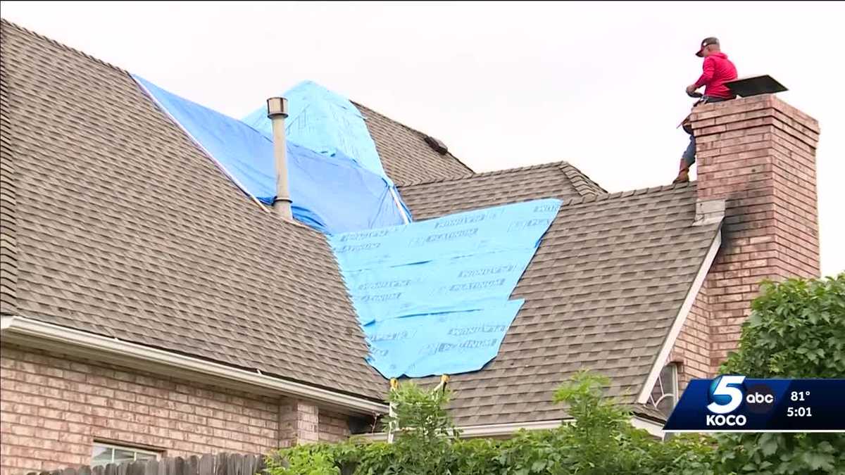Roofers busy at work after lightning caused damage to homes