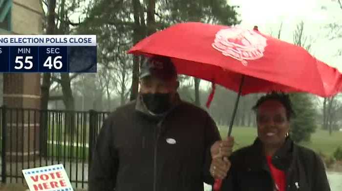 Milwaukee voters brave heavy rain, cold and wind to get to the polls