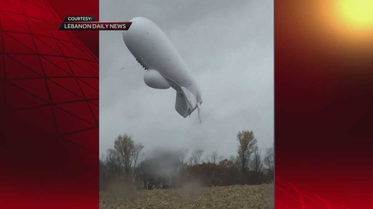 It's down - runaway Army blimp snagged in trees in Pa. field