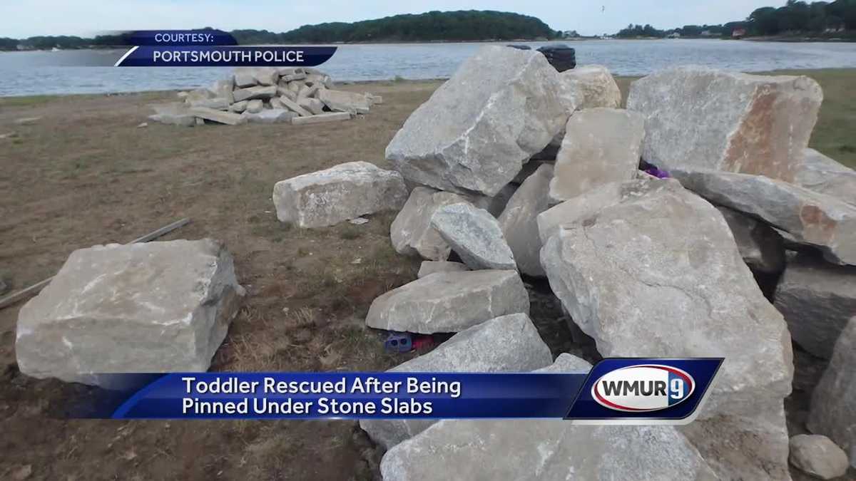 Officers rescue toddler trapped under rocks