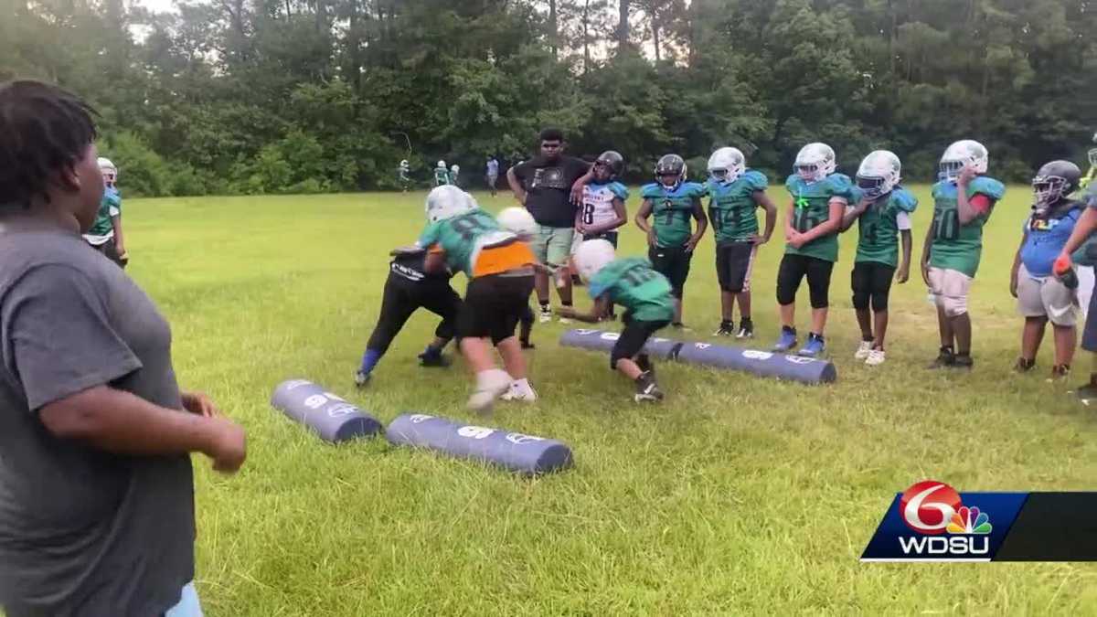 Local football coach makes history by being the first female head coach ...