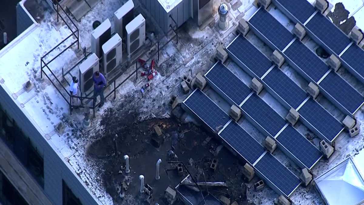 RAW: Solar panels malfunction, catch fire on Boston roof