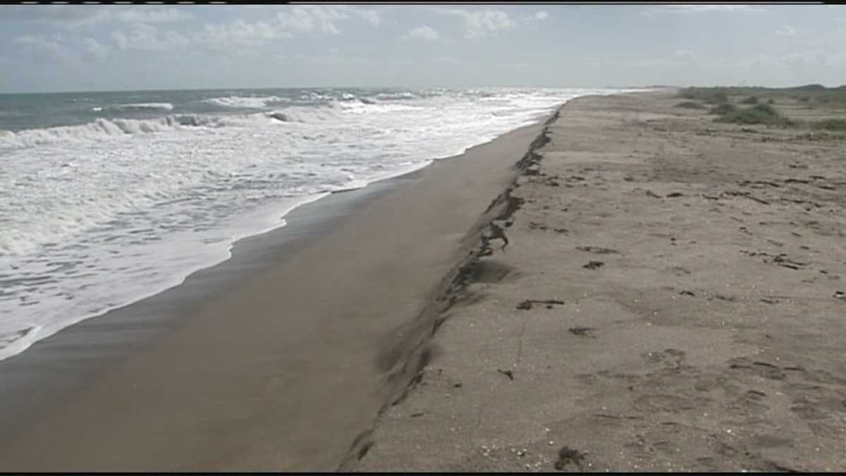 Beach battered by high winds, big waves