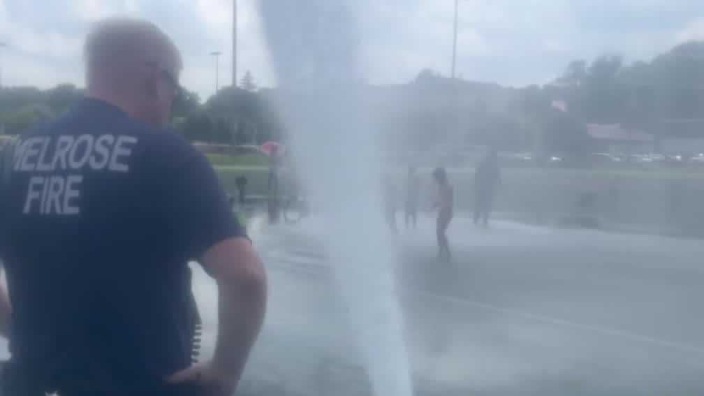 Melrose firefighters use fire hose to help kids cool down