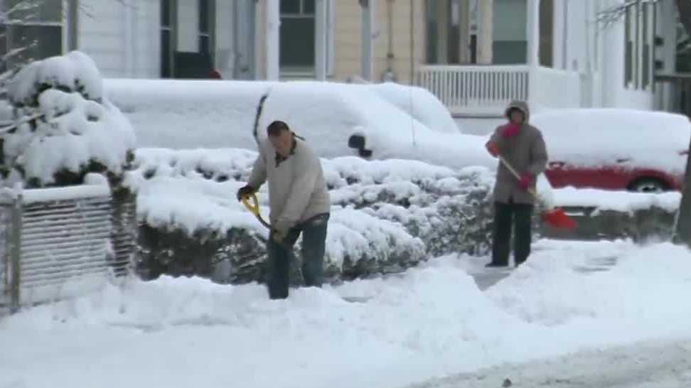 Residents work to clear snow in Worcester