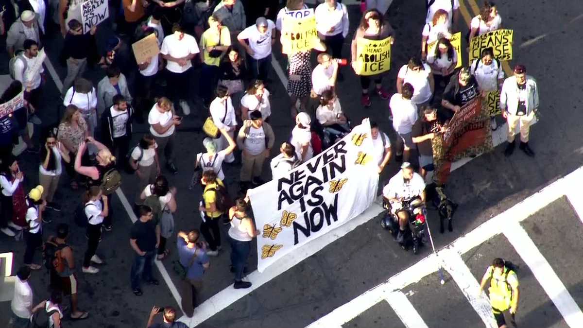 Group protesting ICE march through streets of Boston during rush hour